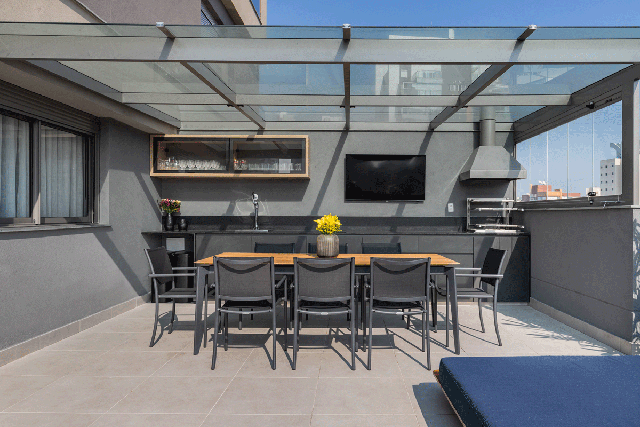 Living com ilha central esconde lavanderia entre os armários em apê ...