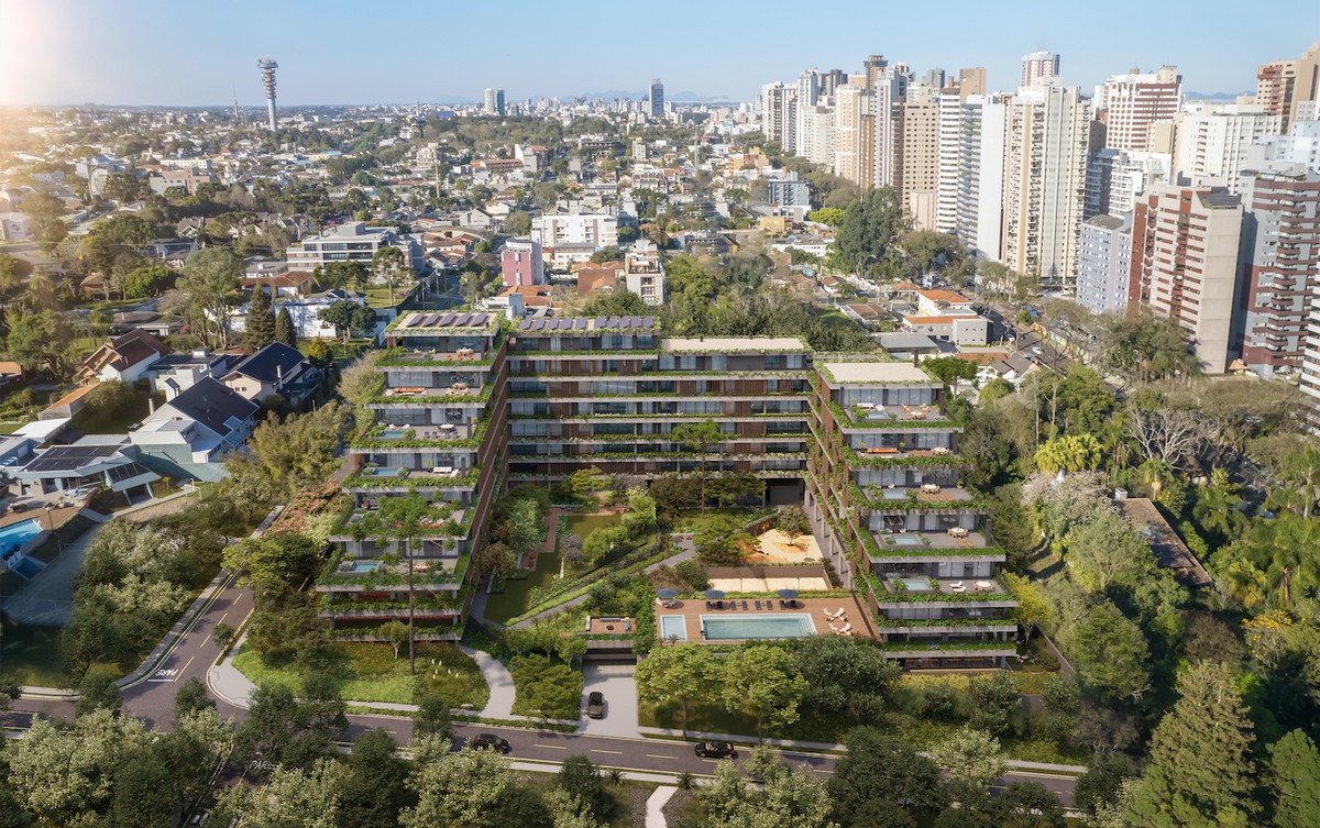 Arquitetura escalonada valoriza contato com o verde em edifício